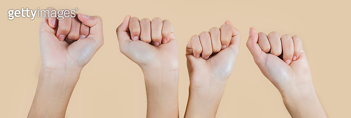 Multiple views of four hands with clenched fist, woman's hands on beige ...