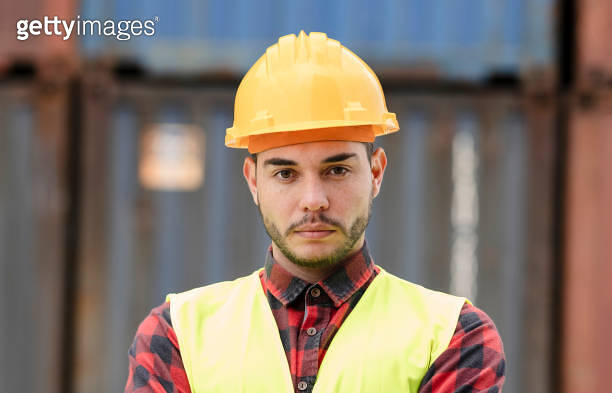 Portrait young Caucasian male engineer in transport industry wearing ...
