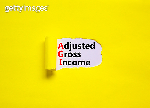 AGI adjusted gross income symbol. Concept words AGI adjusted gross ...