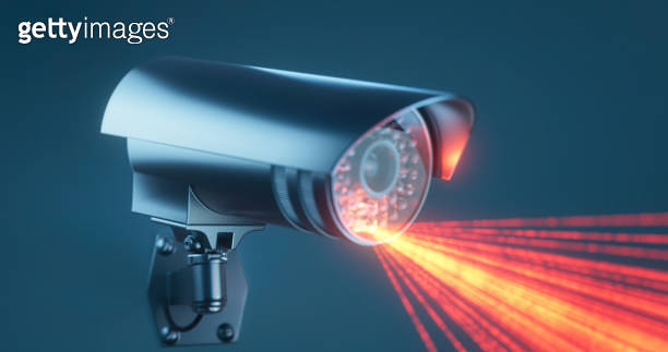 Infrared light coming from the CCTV camera on a blue background with ...