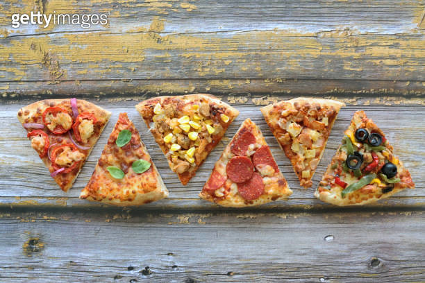 Image of pizza slices with various toppings including feta, tomato ...