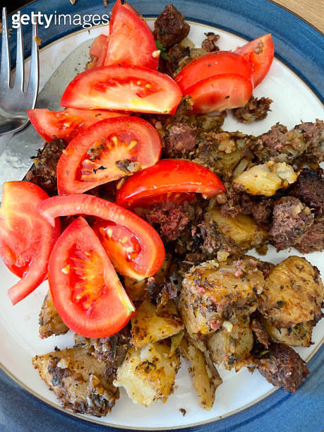 Close-up image of blue rimmed plate containing corned beef hash recipe ...