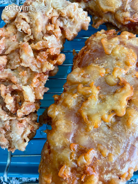 Full frame image of battered, single, fish fillets of Basa (Pangasius ...