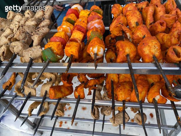 Close-up image of food stall shelving rack display of chicken and ...