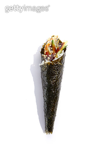 Japanese temaki sushi with eel, cucumber and unagi sauce on white ...