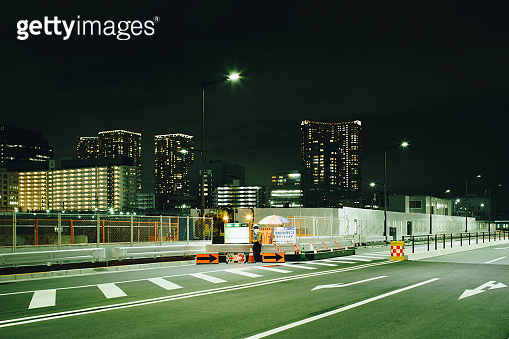 Scenery of a security guard working on traffic control at a road ...