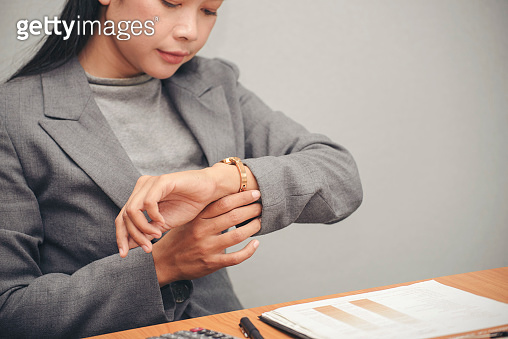 Time out concept. Urgent work, business woman seeing wrist watch and ...