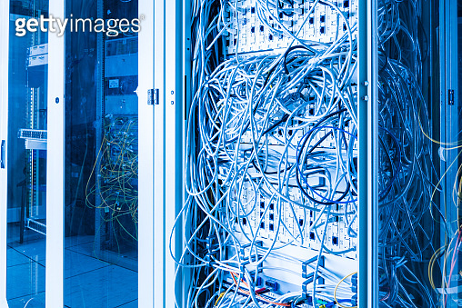 server rack with switch boards and cables (1411558839) - 게티이미지뱅크