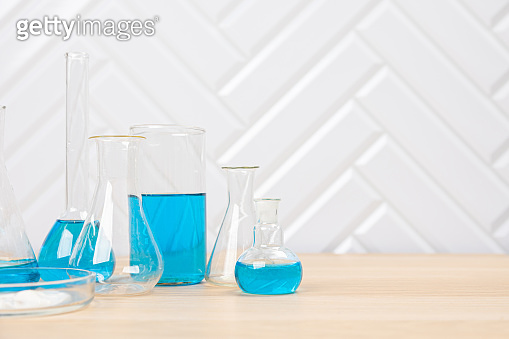 Laboratory glassware with test tubes. flasks, dropper, petri dishes ...