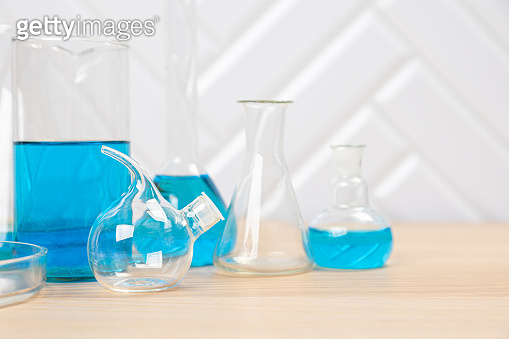 Laboratory glassware with test tubes. flasks, dropper, petri dishes ...