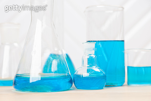 Laboratory glassware with test tubes. flasks, dropper, petri dishes ...