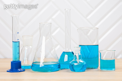 Laboratory glassware with test tubes. flasks, dropper, petri dishes ...