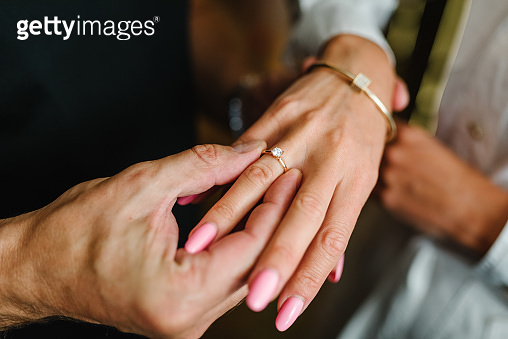 Man in love putting an engagement ring on woman finger. Propose ...