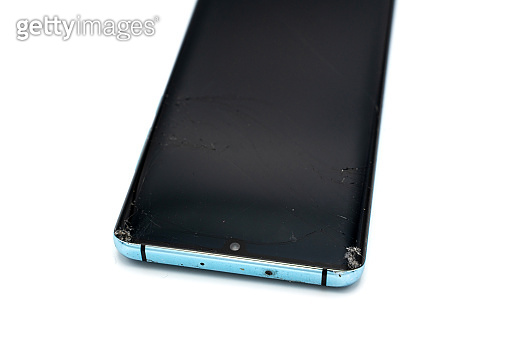 Broken smartphone screen, destroyed and scratched display on isolated ...