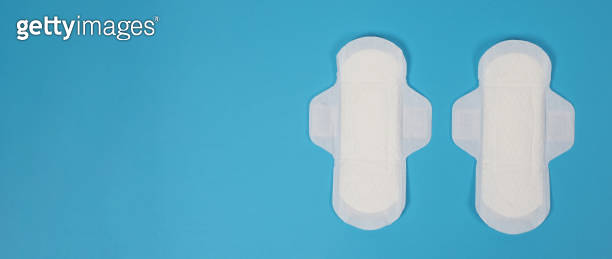 Woman sanitary napkins on blue background. Top view. Absorbent pads ...