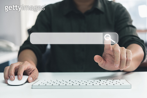 Searching Browsing Internet Data Information with blank search bar. man's hands are using a ...