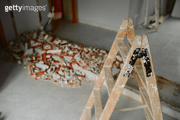 ladder and debris at home construction site. Home renovation ...