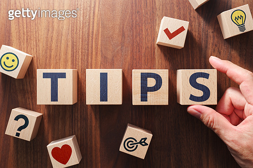 The word "TIPS". Putting wood cubes with alphabets and icons ...