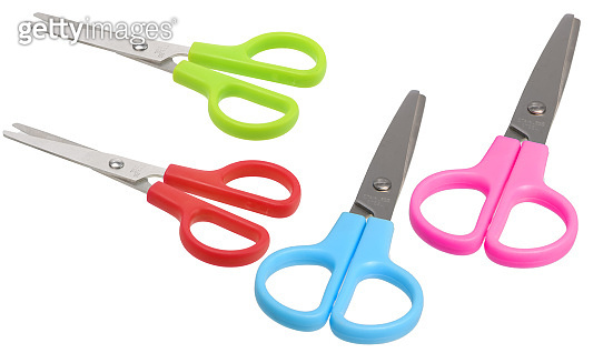 children's scissors on an isolated background. Different colors of ...