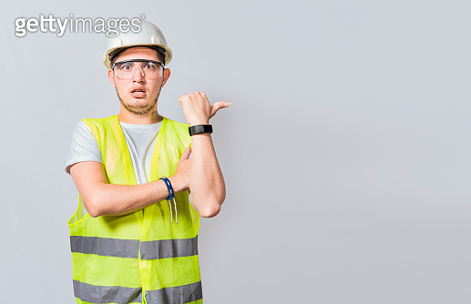 Amazed Engineer pointing to side. Surprised engineer pointing finger to ...