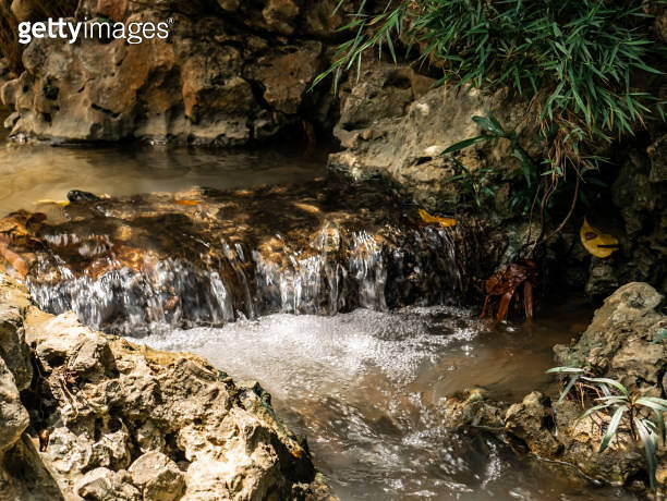small waterfall stream on rocky river in forest 이미지 (1369507444) - 게티이미지뱅크