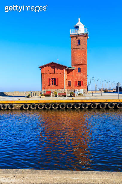 Old brick lighthouse at the Wieprza river mouth to the Baltic Sea in ...