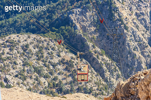 Cable car on ropeway leading to a top of Tahtali mountain in Antalya ...