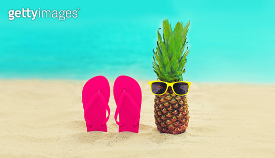 Summer vacation concept - pineapple with sunglasses and colorful flip ...