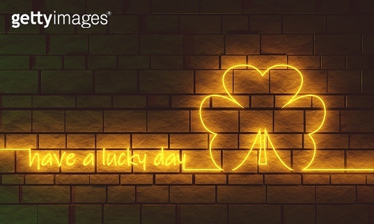 Shamrock silhouette and have a lucky day text. Neon bulb street sign ...