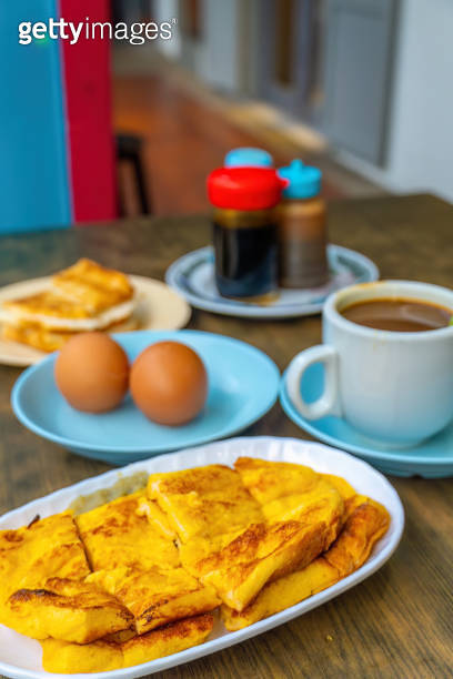 Traditional breakfast set and coffee, boiled eggs and toast, popular in ...
