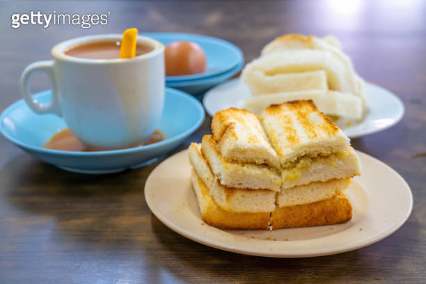Traditional breakfast set and coffee, boiled eggs and toast, popular in ...