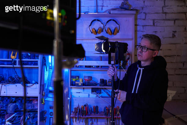 caucasian gaffer professional lighting set up lighting on set ...