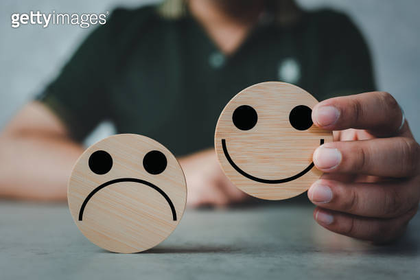 Hand of customer picking happy face for rate service or products ...