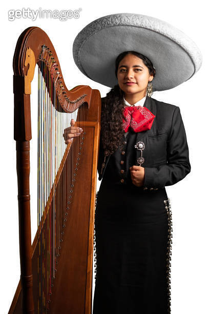 female mexican mariachi harpist woman smiling using a traditional ...