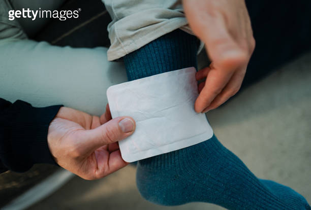 Putting on a self heating pad / exothermic padding before going out ...
