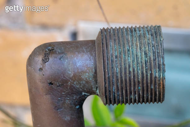 Photograph of the female end of a copper pipe fitting with scratches ...