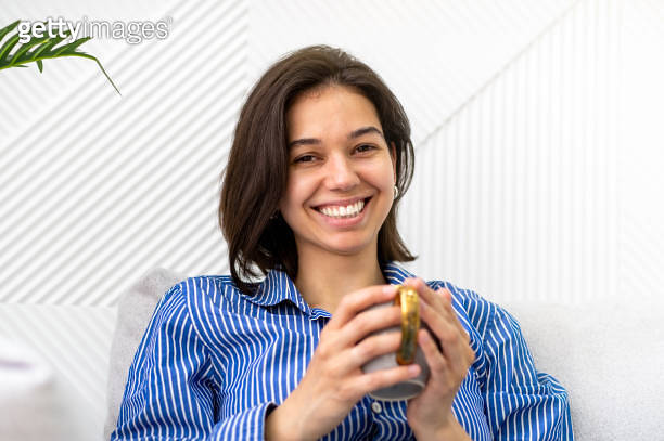 Happy woman holding a cup of coffee, female chill with drink with ...