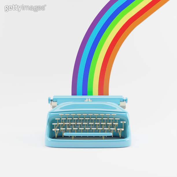 Blue color typewriter with Rainbow printing isolate on white background ...