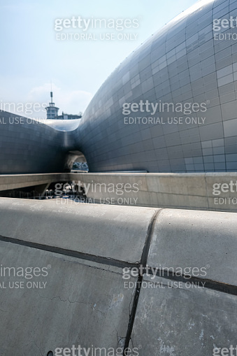 Walkway and Perforated facade cladding of Dongdaemun Design Plaza or ...