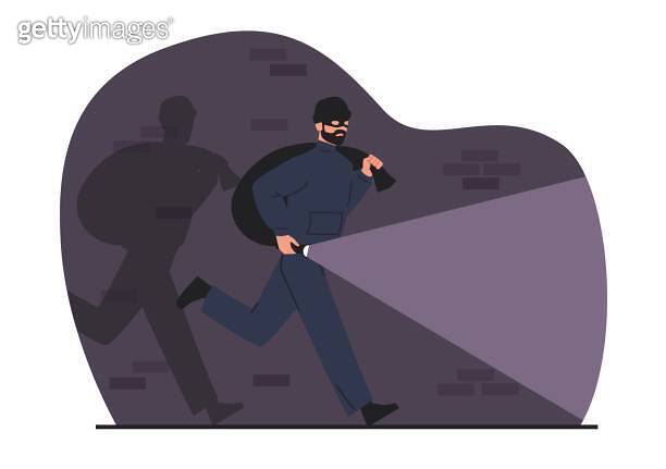 Masked man with bag full of money runs along wall. Thief stealing money ...