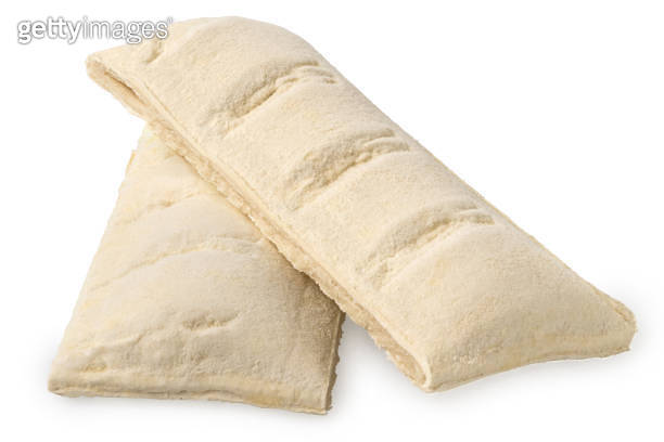 Two uncooked frozen filled puff pastries isolated on white. (1677617863 ...