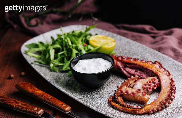 Traditional french octopus braised cooked with salicornia, lemon curd ...