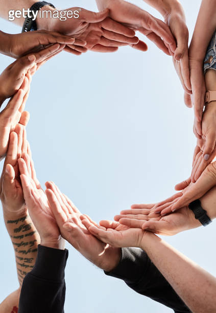 Hands in circle, blue sky and sun, diversity and community in ...