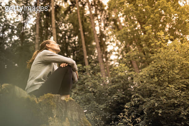 Young woman relaxing meditation contemplating feeling at peace enjoying ...