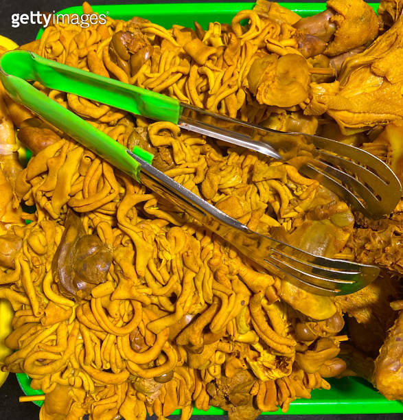seasoned and ready-to-fry chicken intestines at a roadside stall 이미지 ...