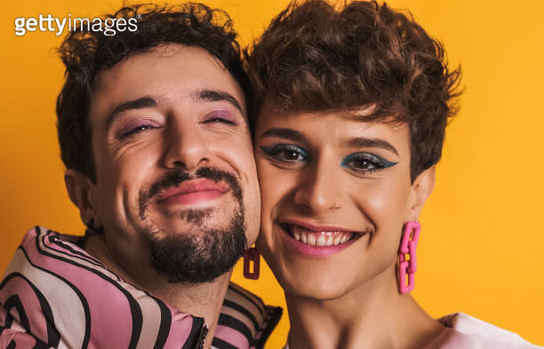 Happy man and drag non-binary in makeup smiling at the camera 이미지 ...
