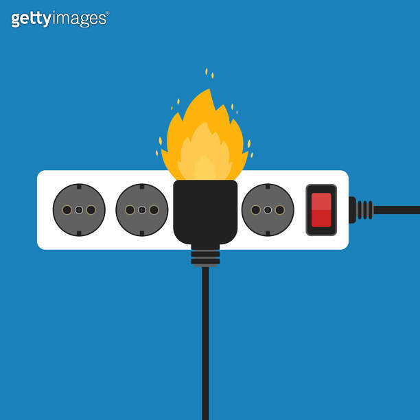 Fire wiring. Socket and plug on fire from overload. Electrical safety ...