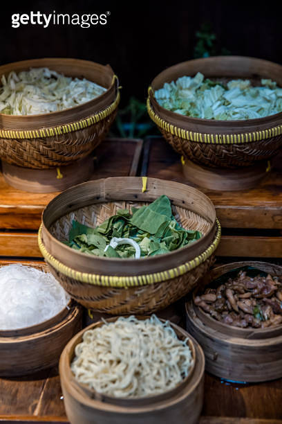Noodle bar among catering banquet table. Variety of snacks, appetizers ...