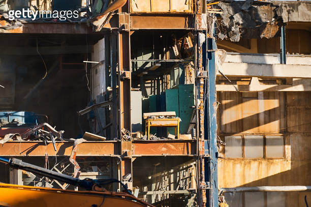 Part of destroyed industrial building at demolition site 이미지 ...