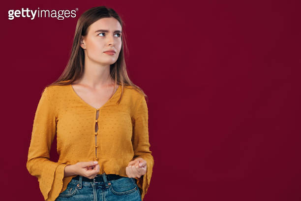 Young emotional sad, frustrated and bewildered woman. Human emotions ...